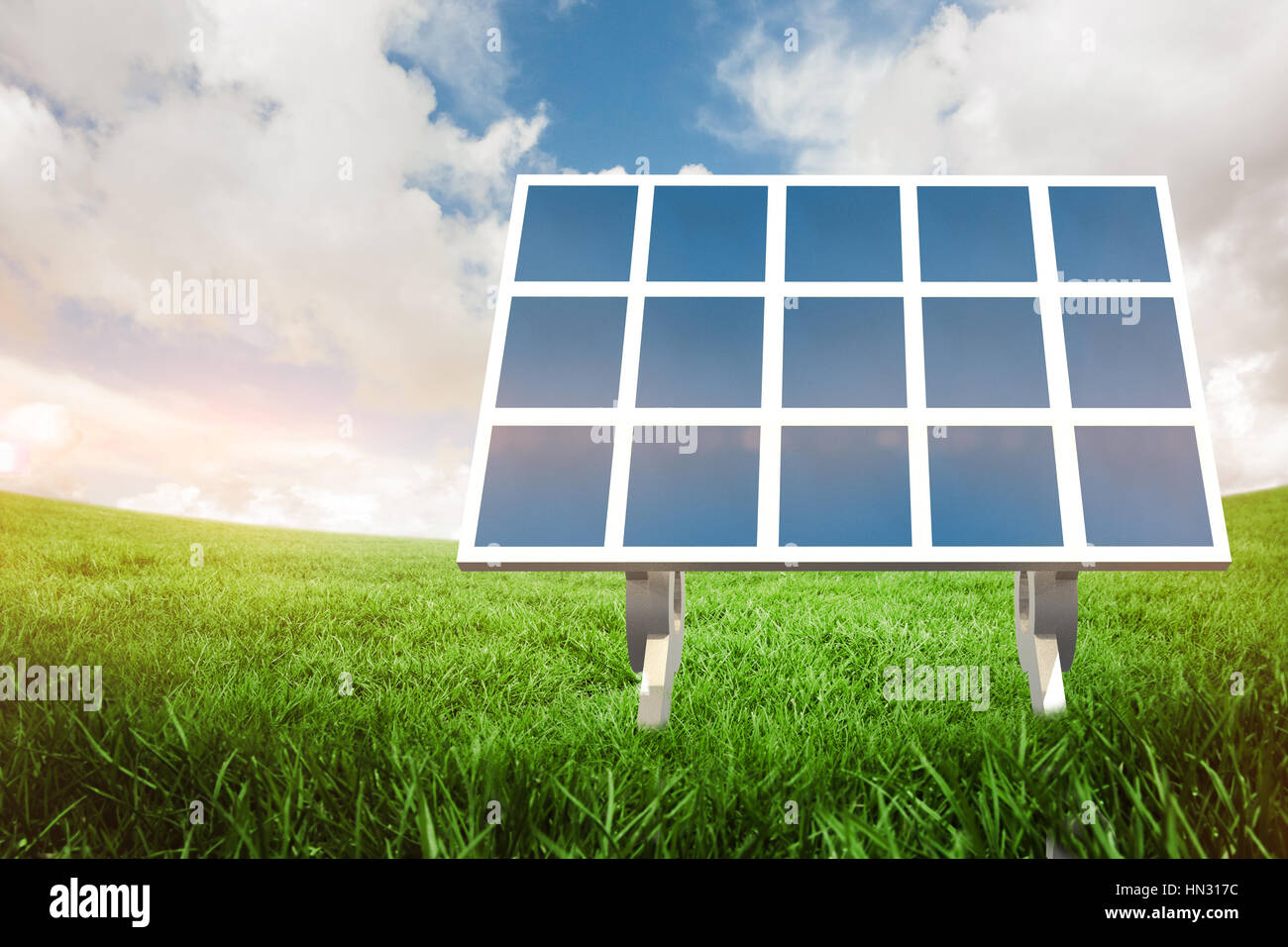 Blue solar panel against green field under blue sky Stock Photo - Alamy
