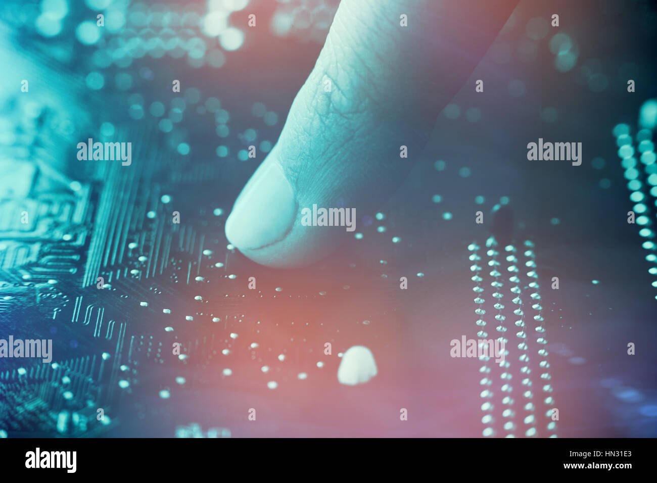 Close-up of a woman hand touching motherboard Stock Photo - Alamy