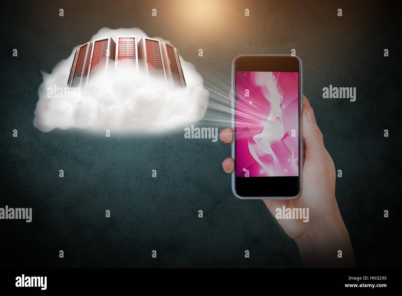 Hand holding mobile phone against black background Stock Photo - Alamy