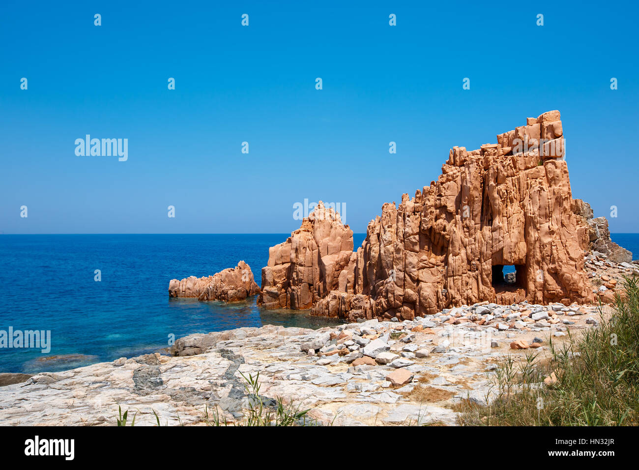 Red rocks and turquoise water of Arbatax, Sardinia, Italy Stock Photo ...