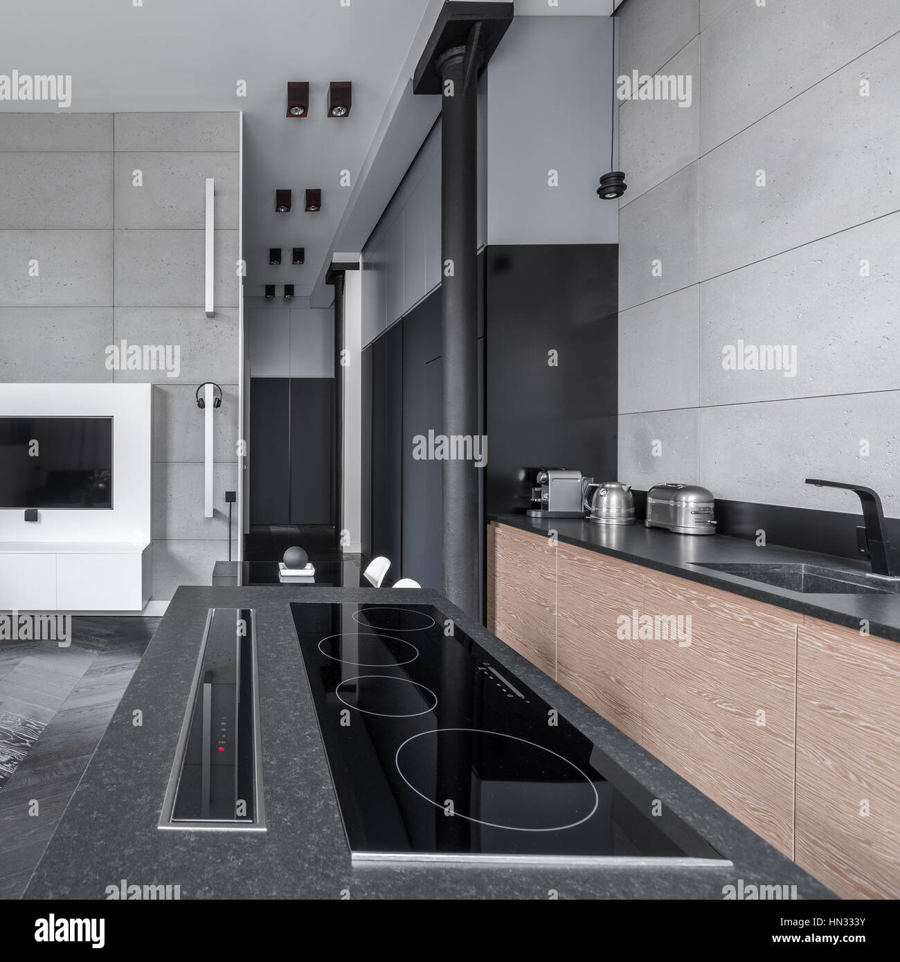 Open cooking area in modern and multifunctional apartment Stock Photo ...