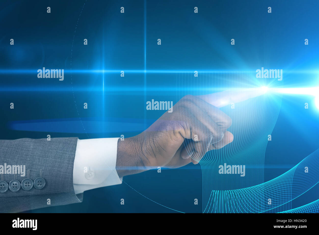 Businessman hand pointing finger against futuristic glowing blue ...