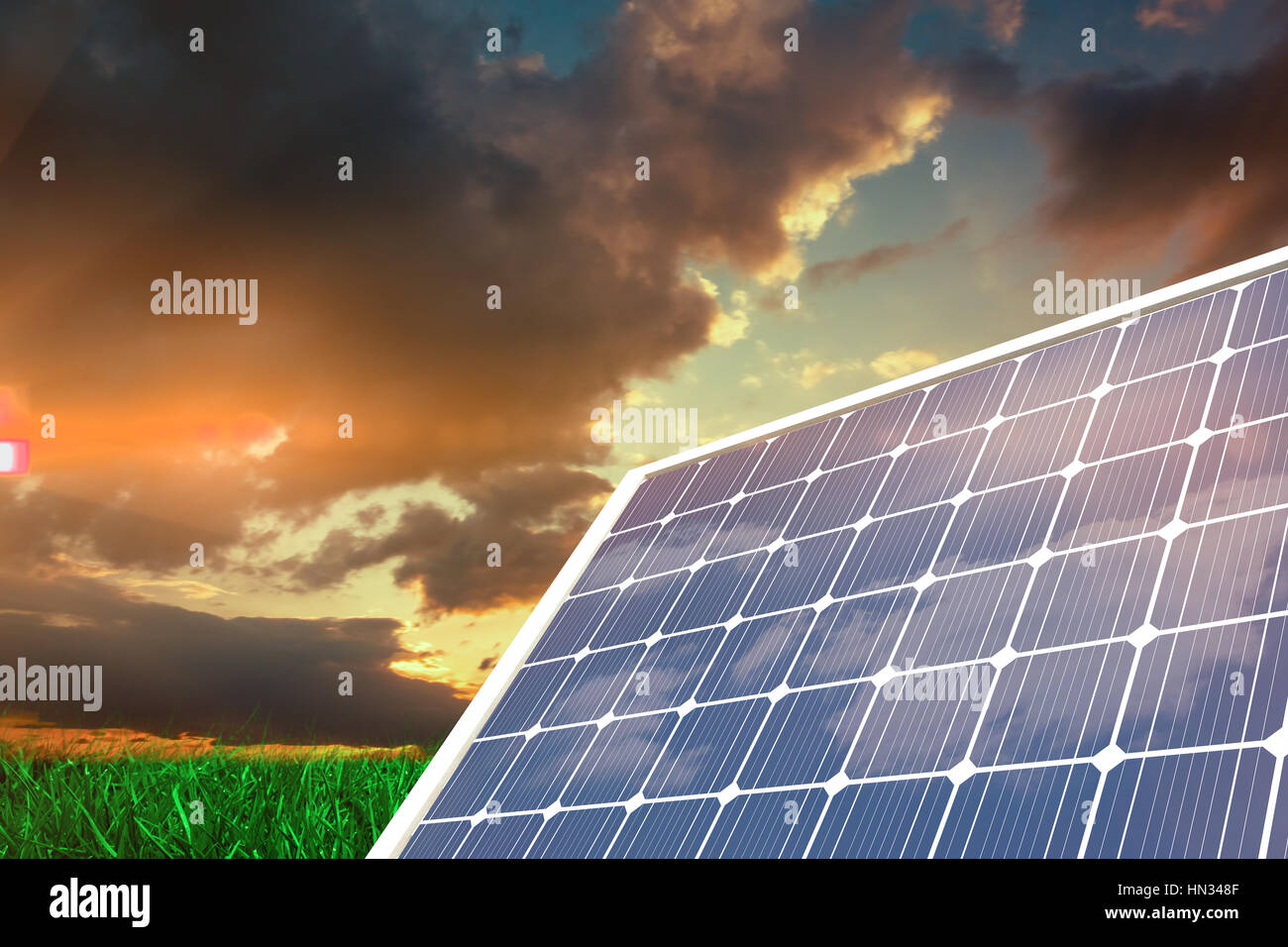 Solar panel with hexagon shape glasses against green grass under dark ...