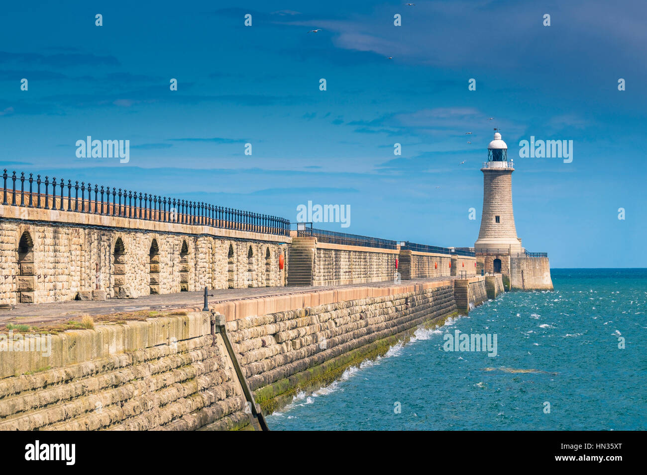 Tynemouth north pier of the harbour and it's lighthouse Stock Photo - Alamy