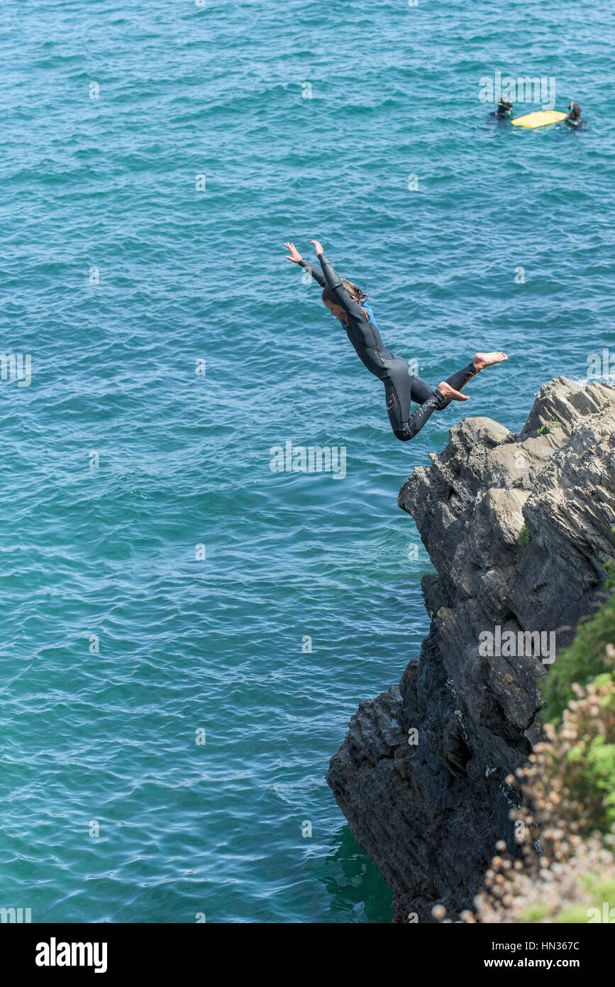 Young people jumping off cliffs hi-res stock photography and images - Alamy