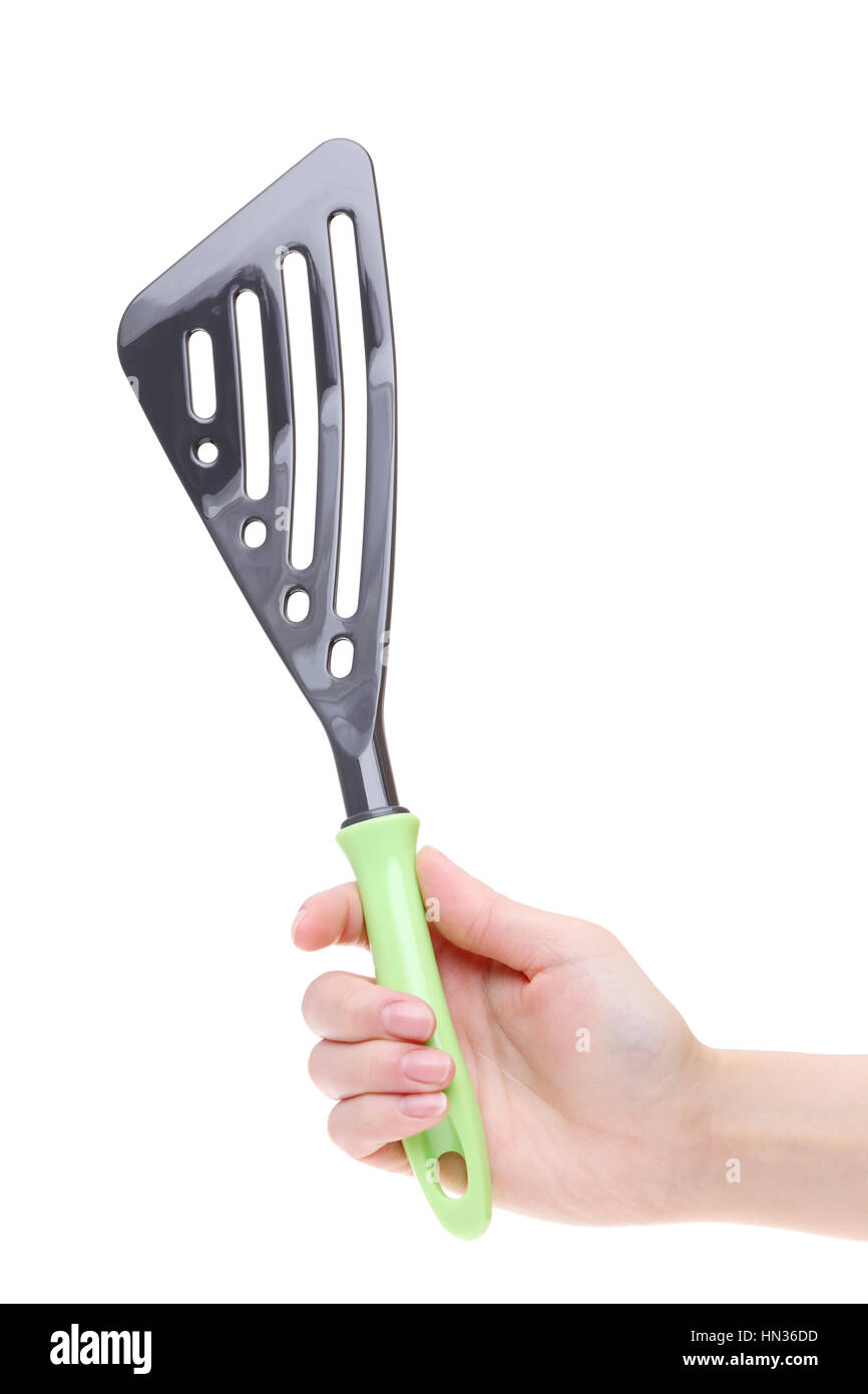 Hand holding spade for frying pan isolated on a white background Stock ...