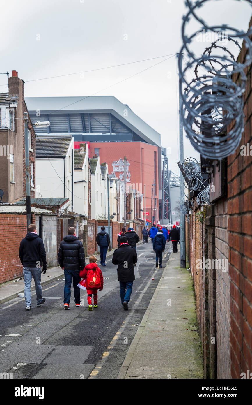 Fans wonder down a typical street in Anfield to watch Liverpool in the ...