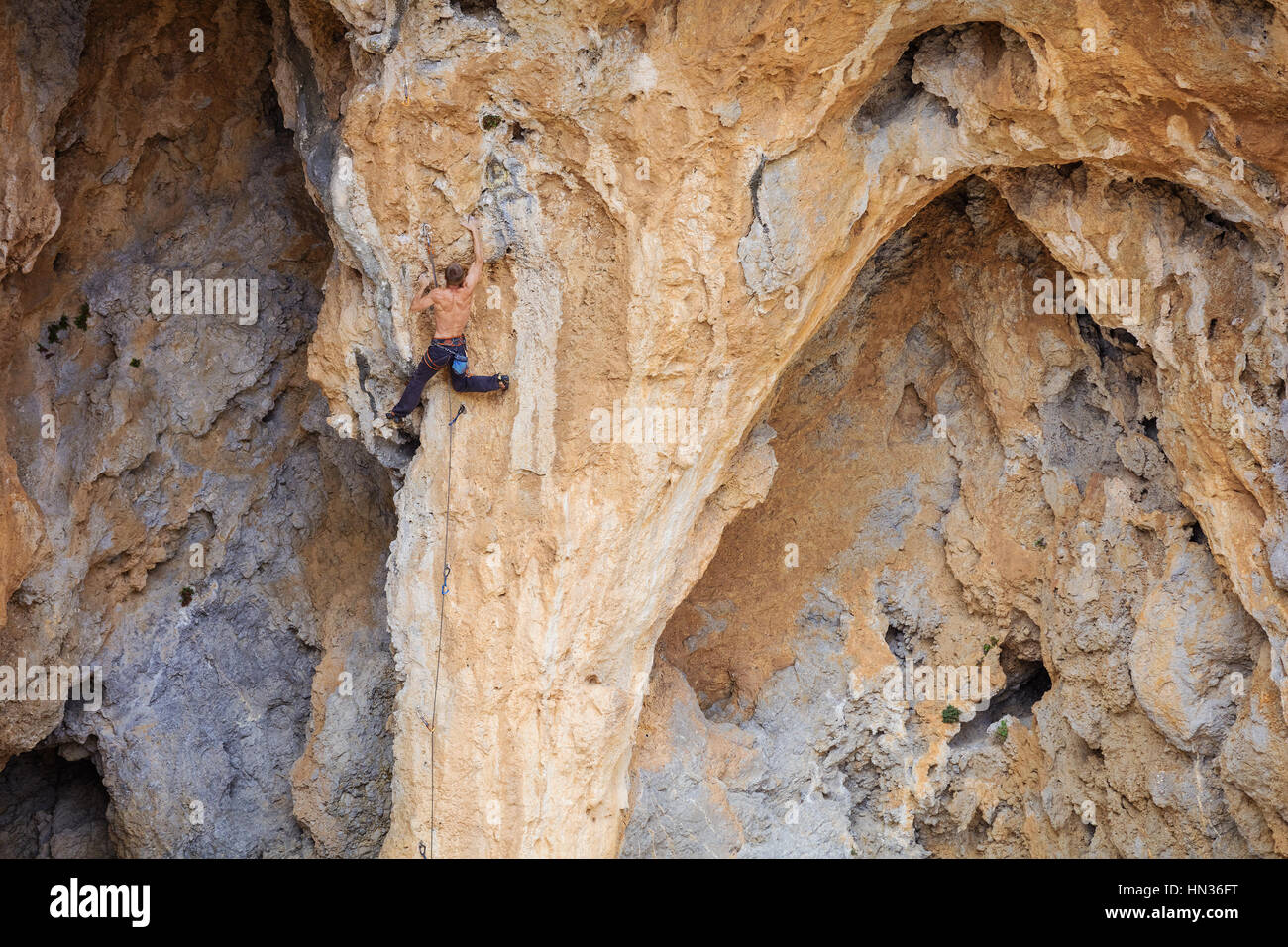 Rock climber resting before reaching Stock Photo - Alamy