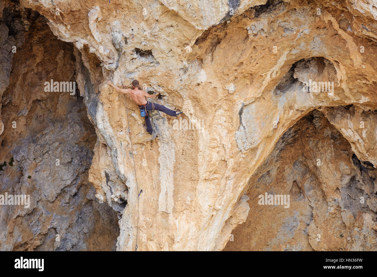 Rock climber resting before reaching Stock Photo - Alamy