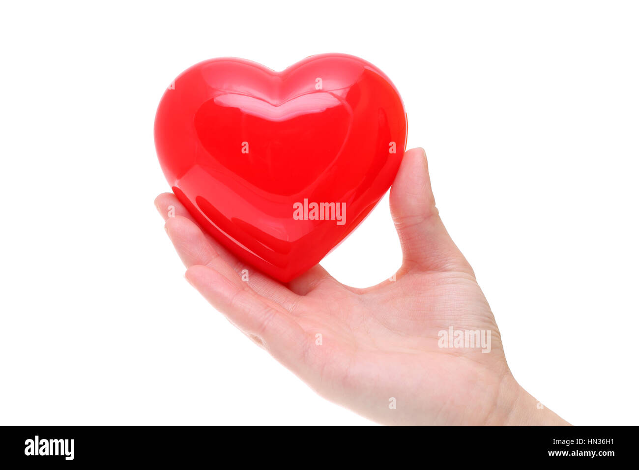 Woman holding red heart on Cut Out Stock Images & Pictures - Alamy