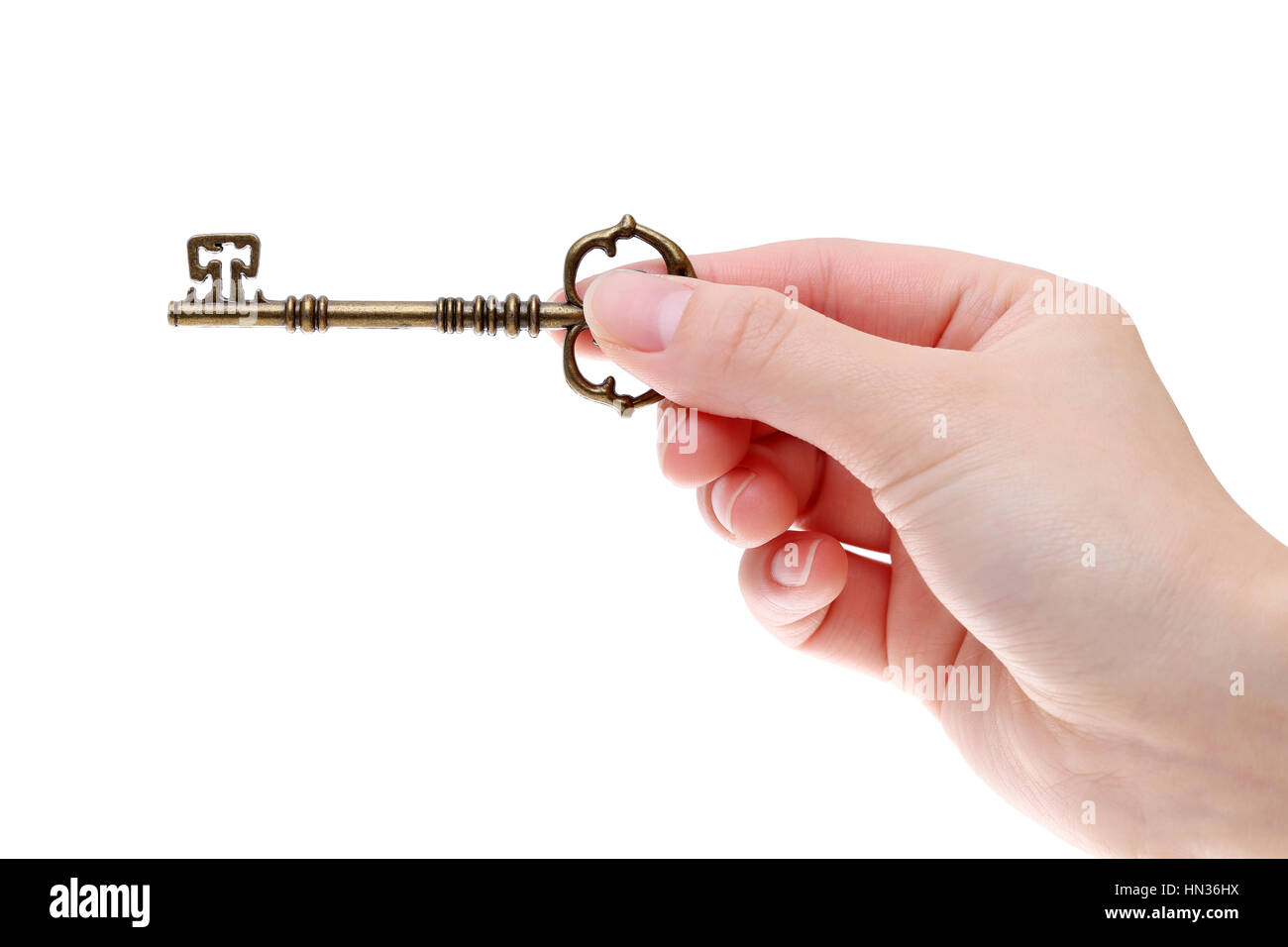 Hand holding antique key isolated on white background Stock Photo - Alamy