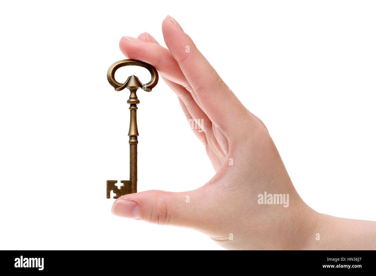 Hand holding antique key isolated on white background Stock Photo - Alamy