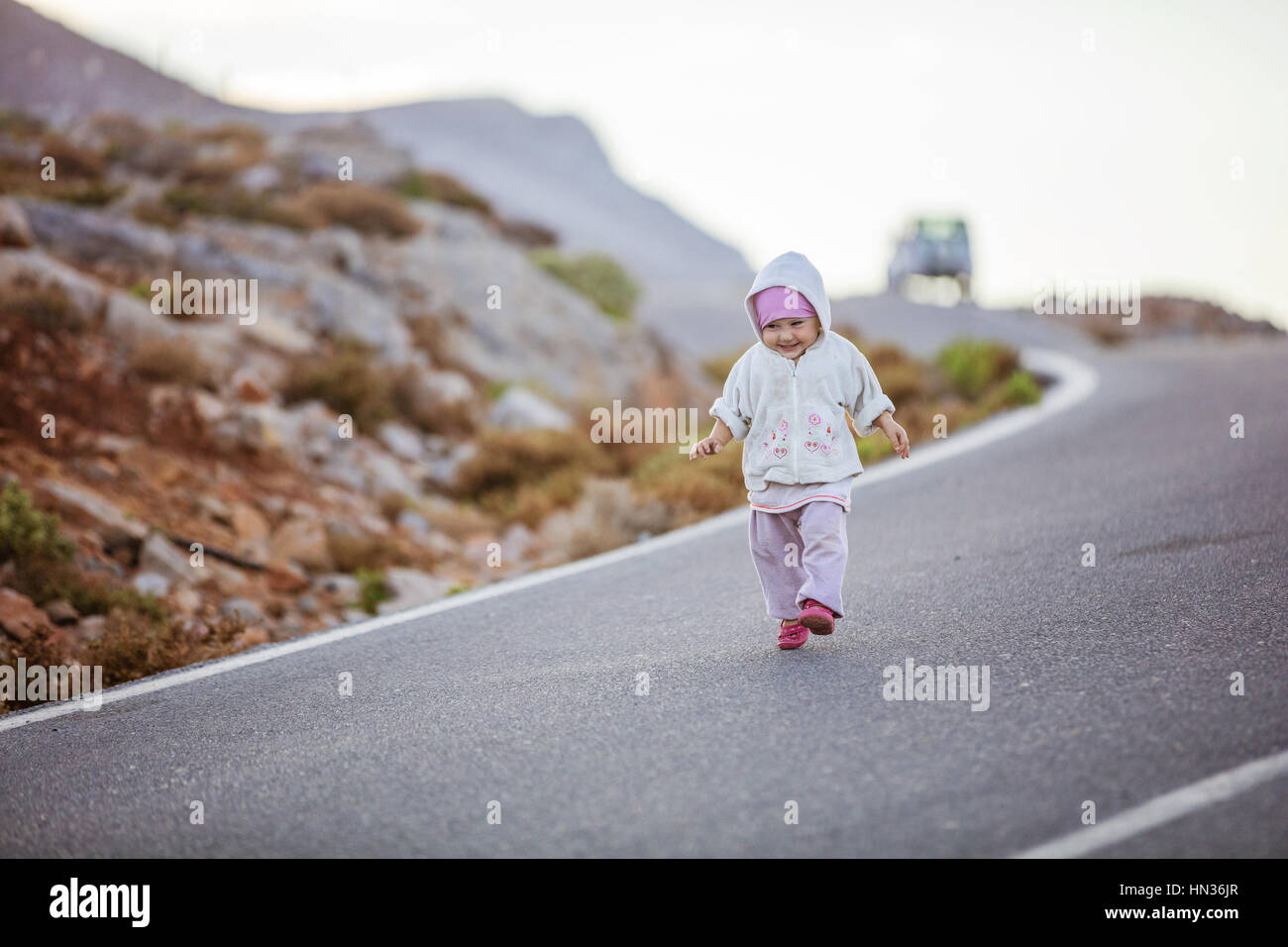 Child running car road danger hi-res stock photography and images - Alamy