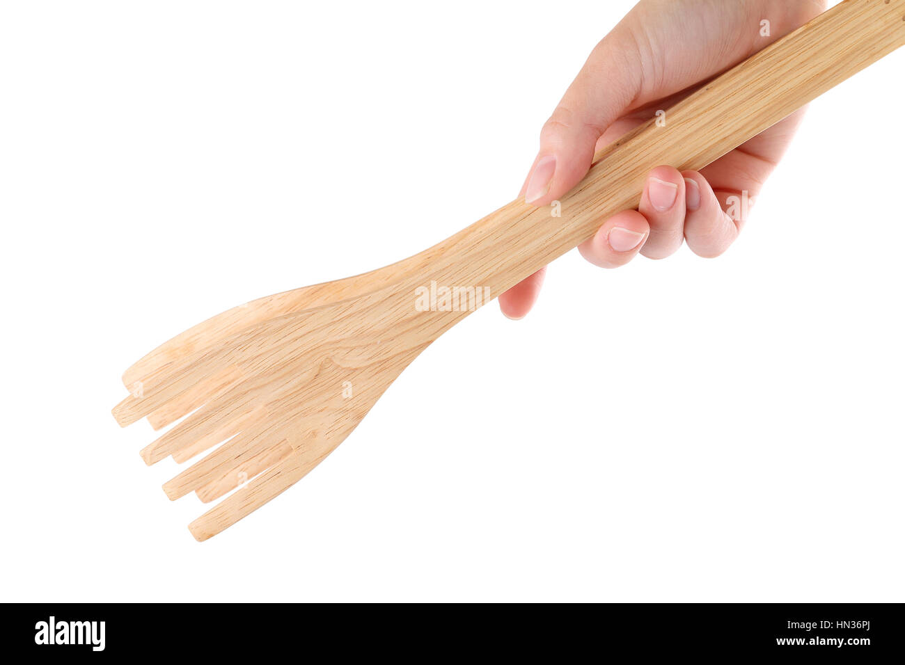 hand holding wooden kitchen tongs isolated on a white background Stock ...