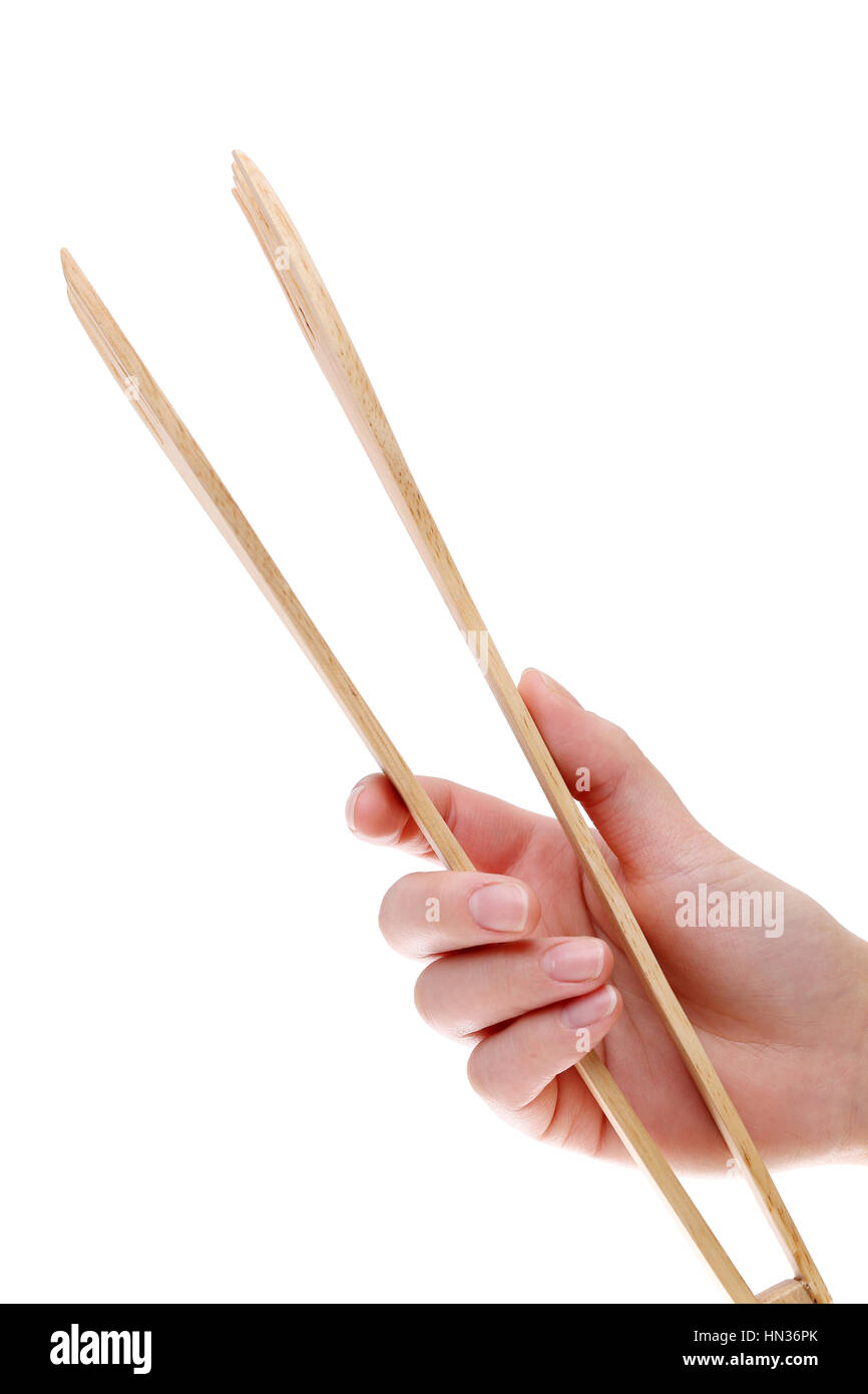Hand holding cooking tongs hi-res stock photography and images - Alamy