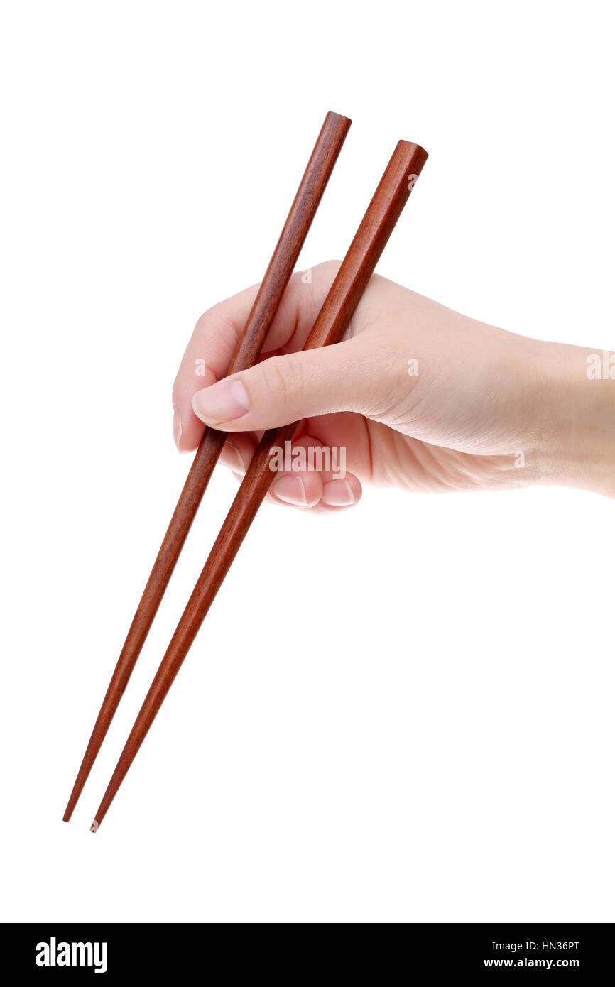 Hand holding wooden chopsticks isolated on white background Stock Photo ...