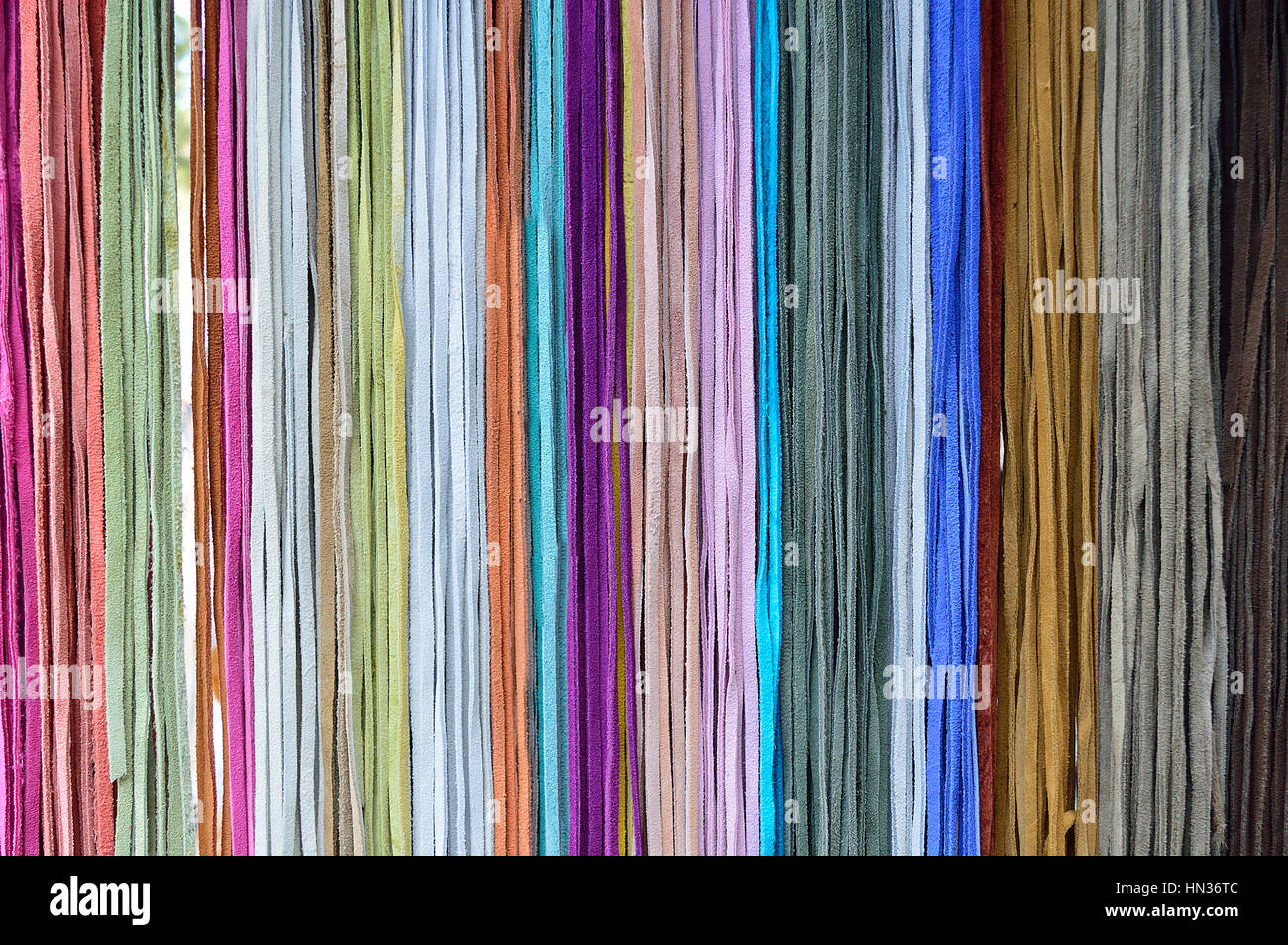Multicolored strings background - yellow, purple, pink, white, gray ...
