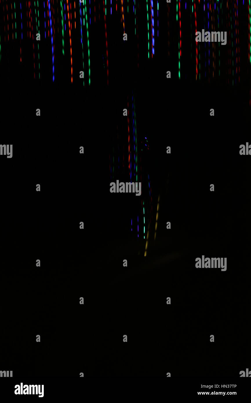 Abstract falling lights against black background Stock Photo - Alamy