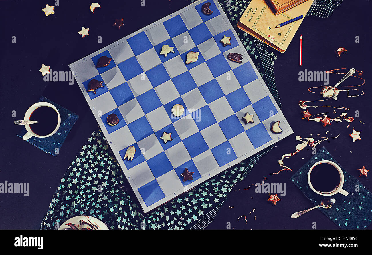 A board of Space Chess with figures of comets and starships made from ...