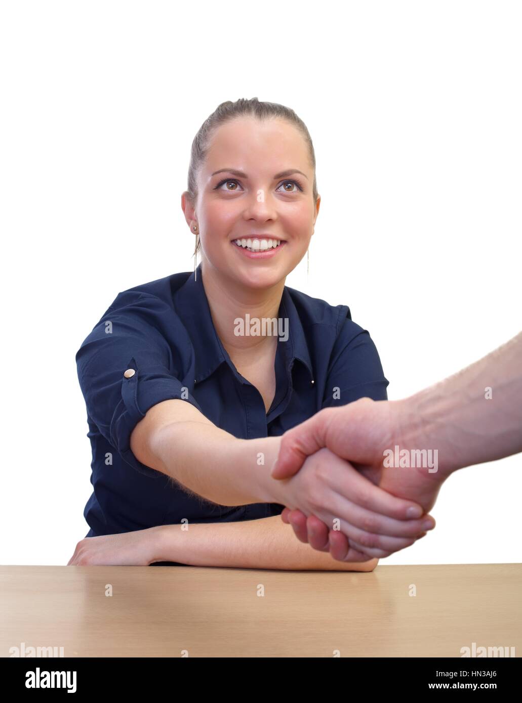Businesswoman shaking hands over the table isolated Stock Photo - Alamy