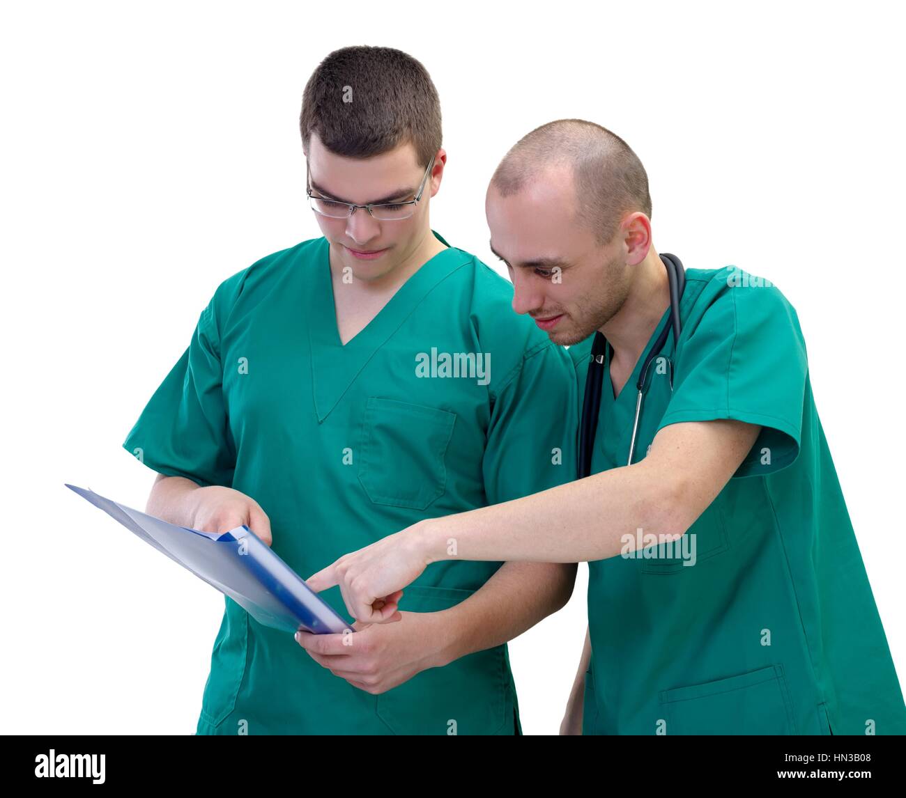 Portrait of two confident doctor holding files Stock Photo - Alamy