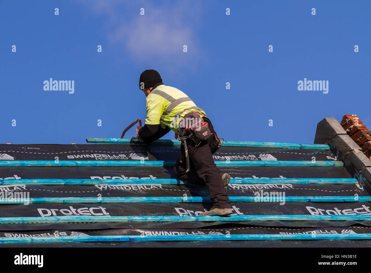 Roofer joiner, workman working on New Build Redrow Homes under ...