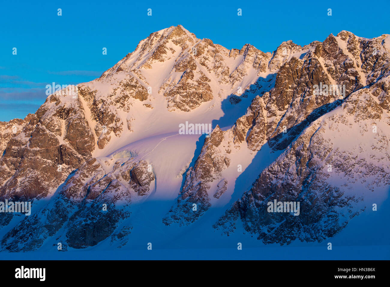 Alpenglow On A Peak In Northern Liverpool Land During A Mountaineering ...