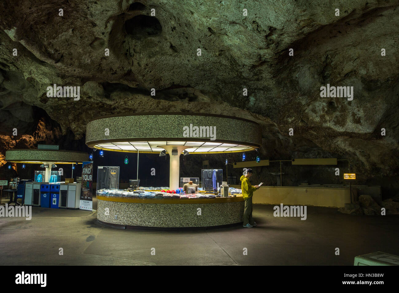 A man reads a map in the glow of a round information booth in a giant ...