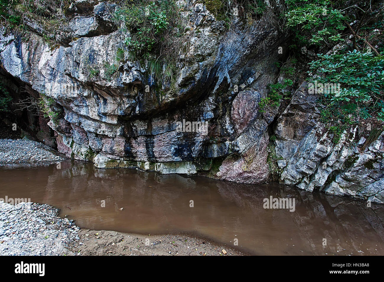 Multi-colored layered rock solid minerals Stock Photo - Alamy