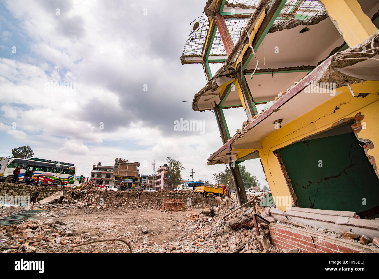 A Collapsed Apartment Building Teeters In A Pile Of Rubble Near Balaju ...