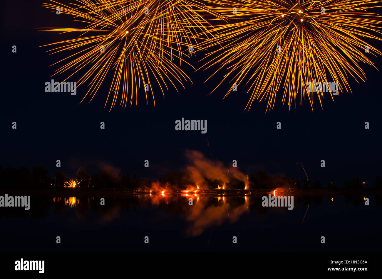 Fireworks display bursts at night Stock Photo - Alamy