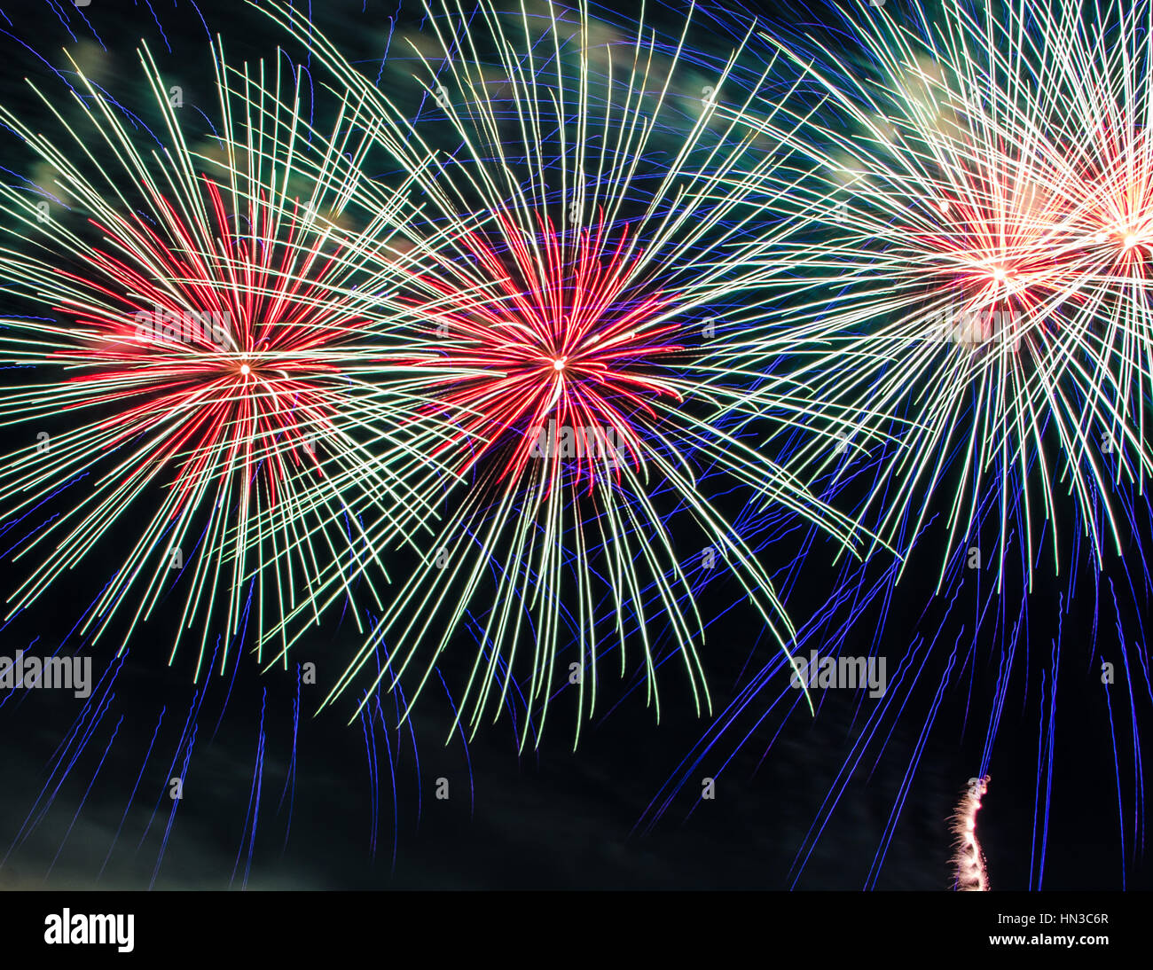 Fireworks display bursts at night Stock Photo - Alamy