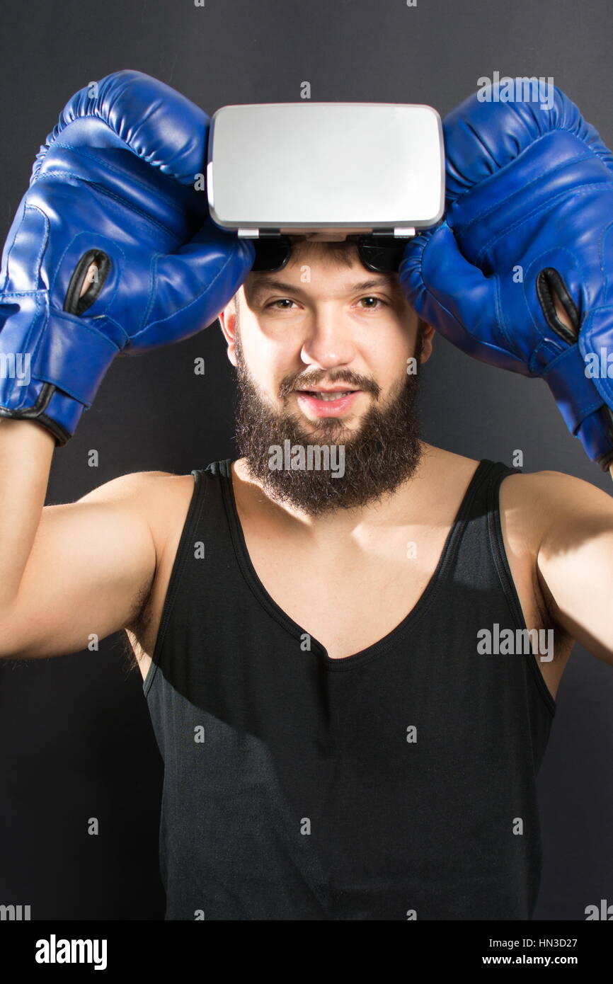 Boxer with VR glasses and blue boxing gloves Stock Photo - Alamy