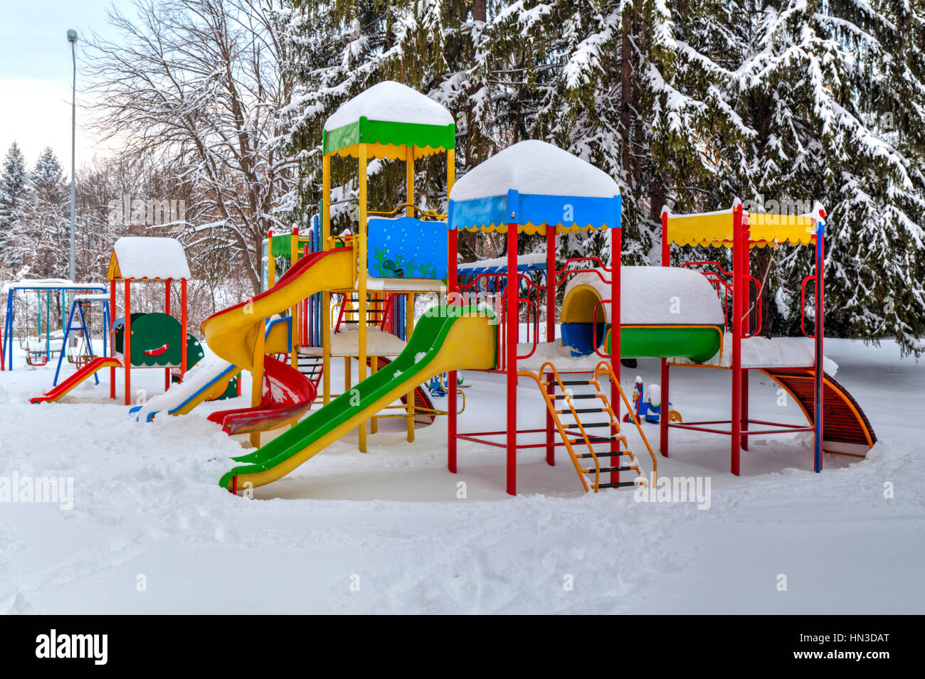 Children's playground covered with snow in winter Stock Photo - Alamy