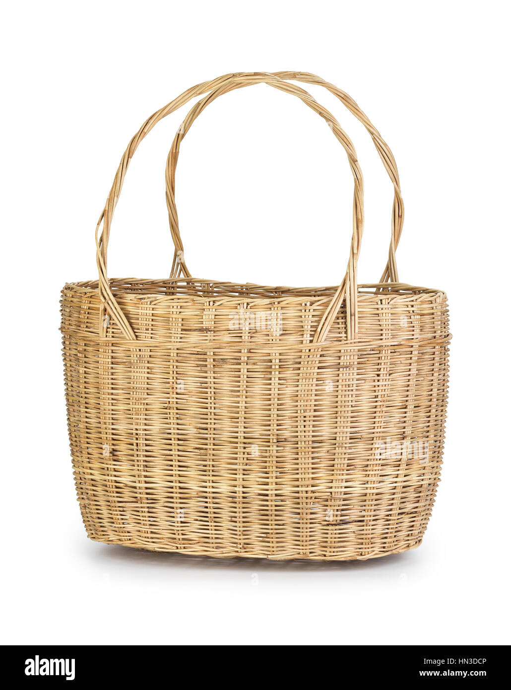 Light brown wicker basket on white background Stock Photo - Alamy