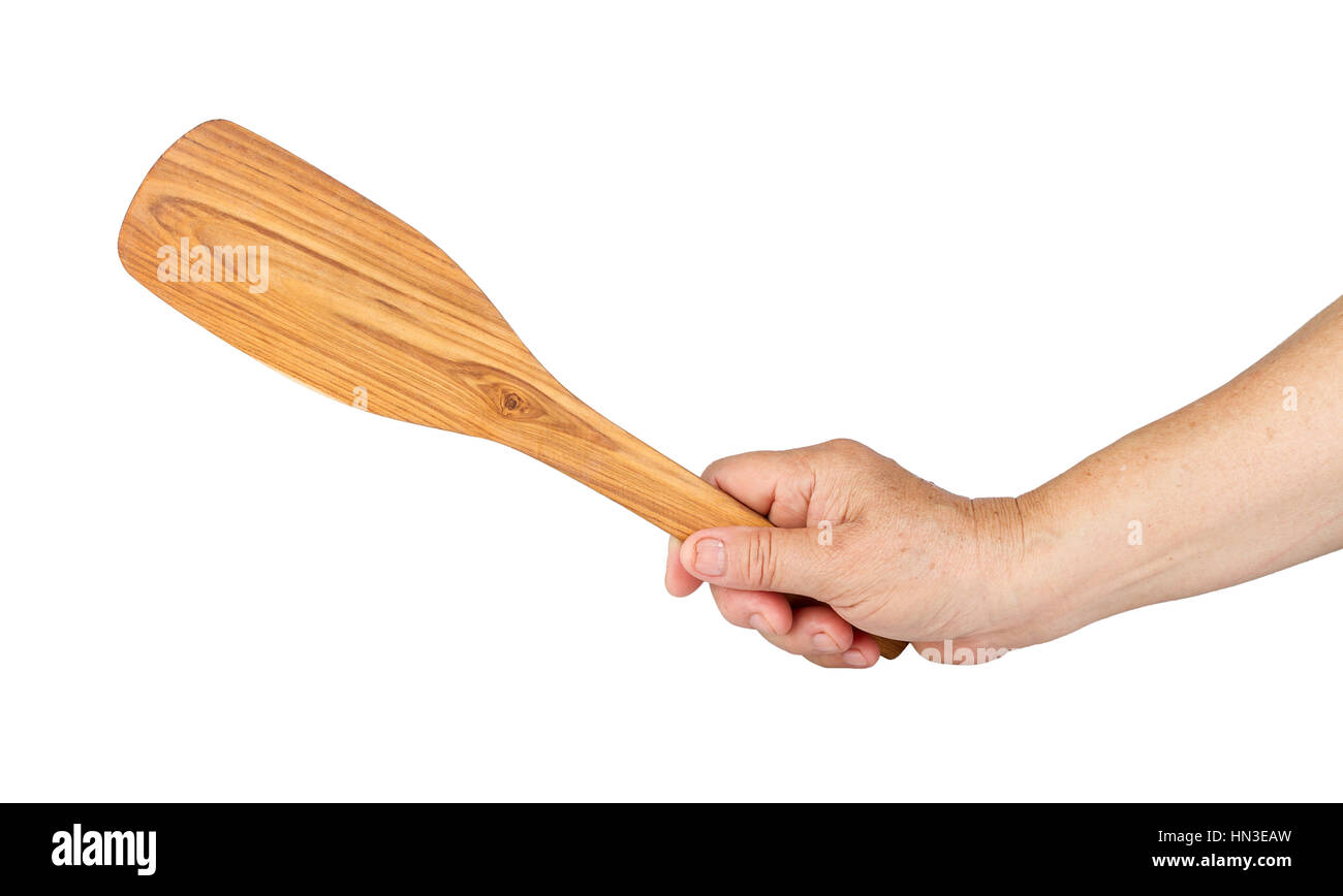 long-handle ladle made from teak in hand isolated on white background ...