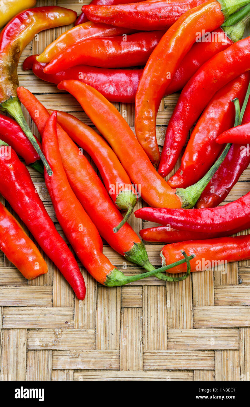 pile of red thai goat pepper on bamboo plate Stock Photo - Alamy
