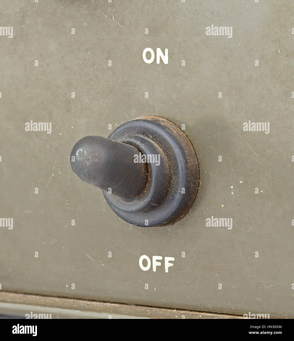 closed up old black toggle switch on green surface - on Stock Photo - Alamy