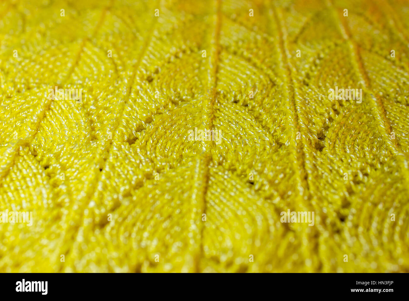 Yellow knitted pattern Stock Photo - Alamy