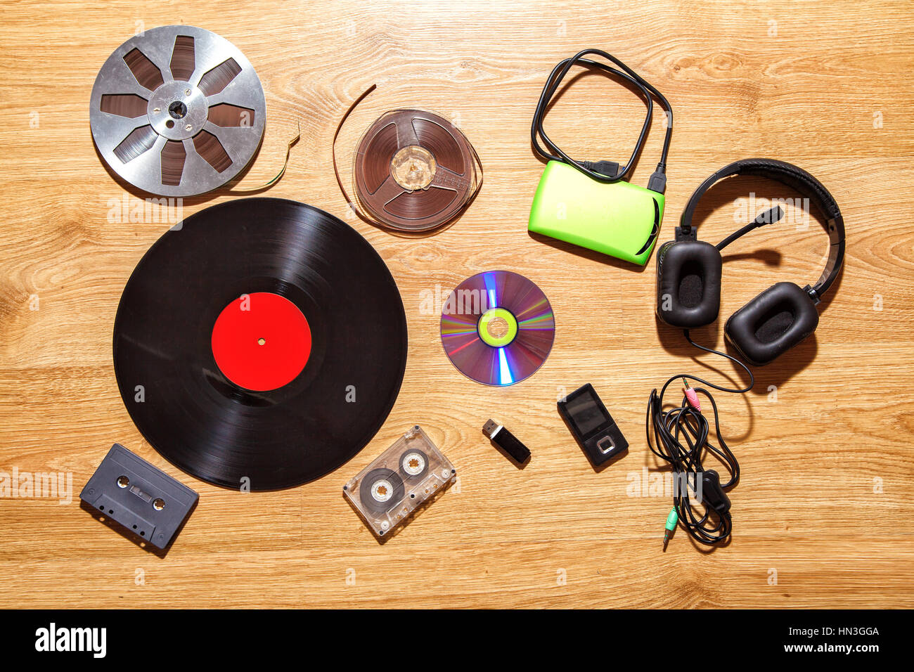 set of retro and modern audio carriers lying on hte wooden floor Stock ...