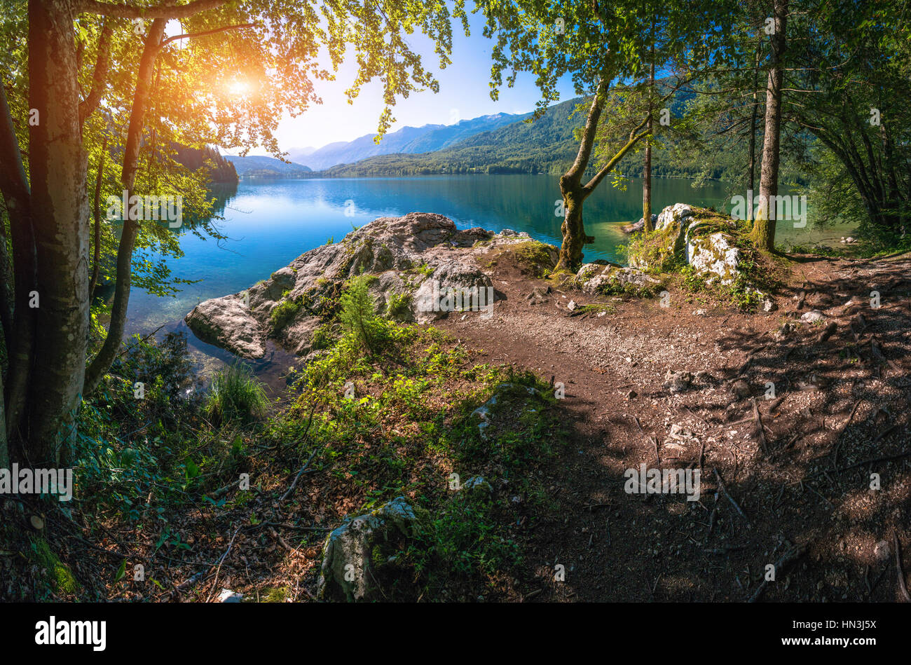 Mountain lake between by mountains Stock Photo - Alamy