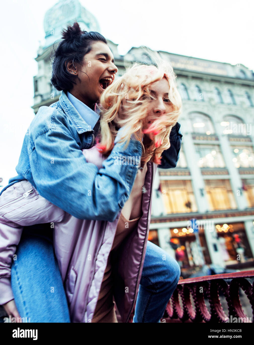 Two teenage girls infront of university building smiling, having Stock ...