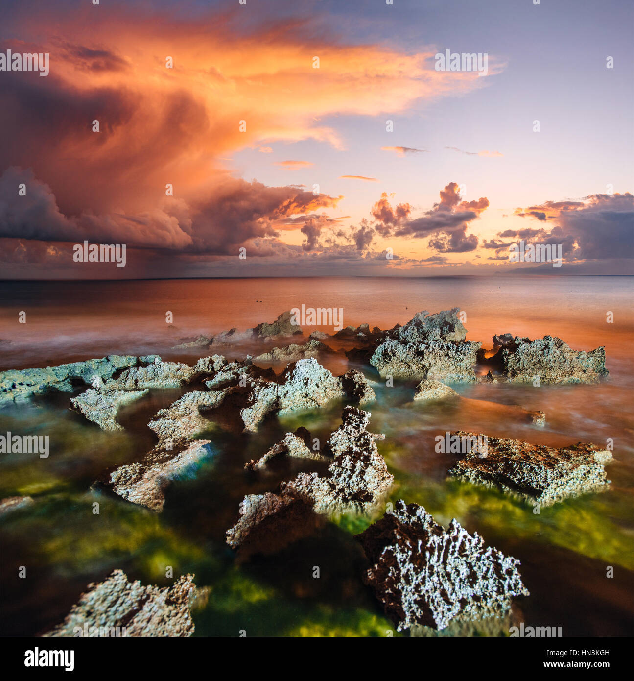 sunset at coast of the sea Stock Photo - Alamy