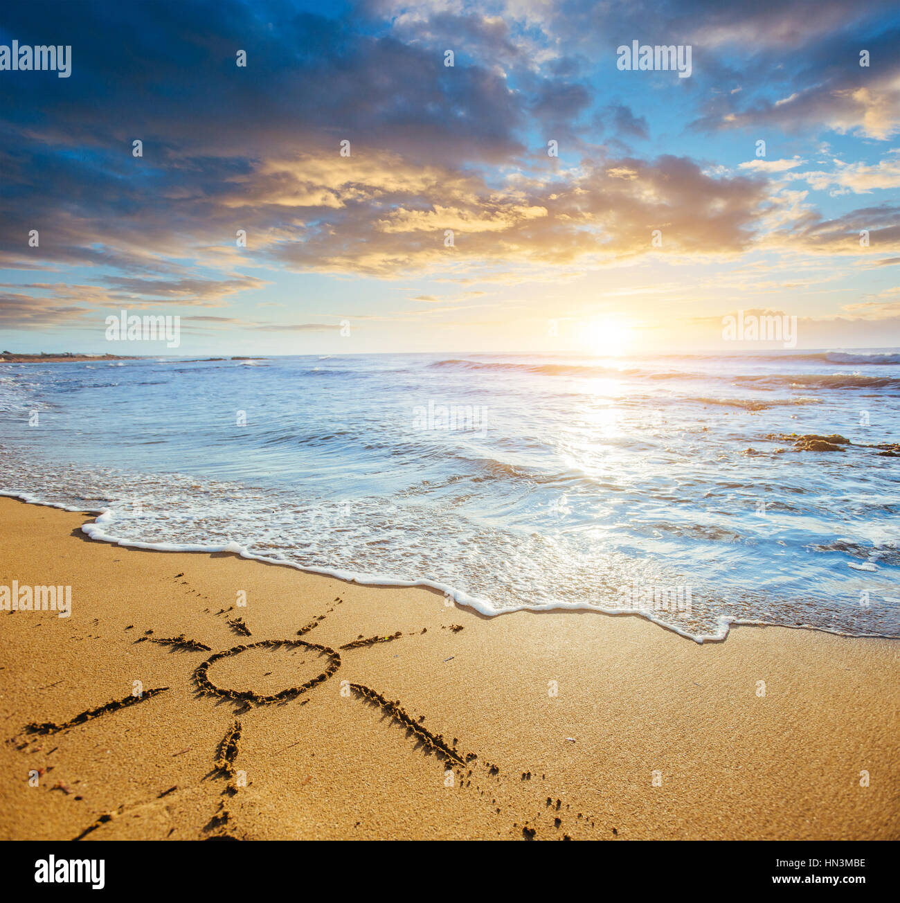 Sunset on the beach Stock Photo - Alamy