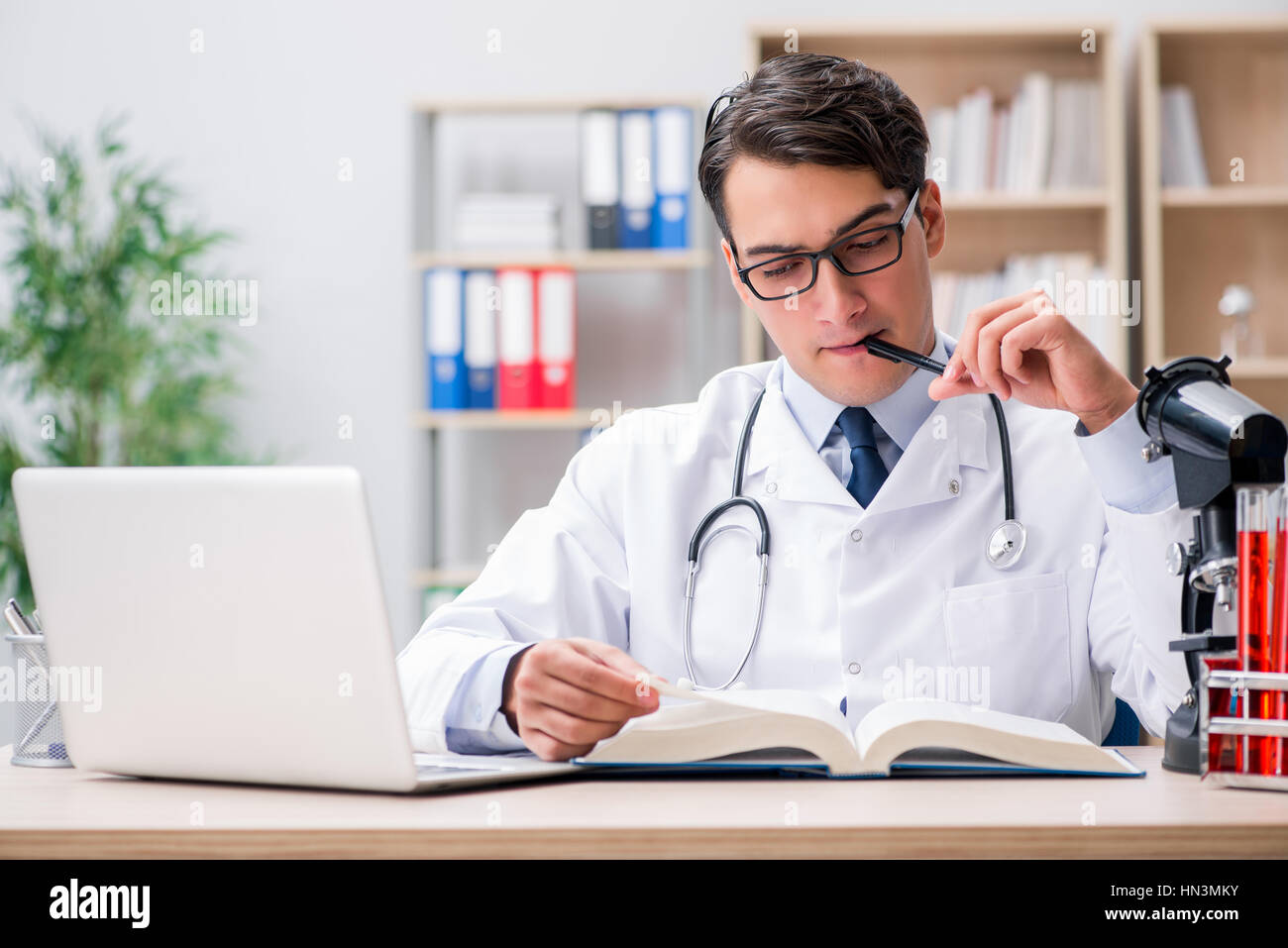 Young doctor studying medical education Stock Photo - Alamy
