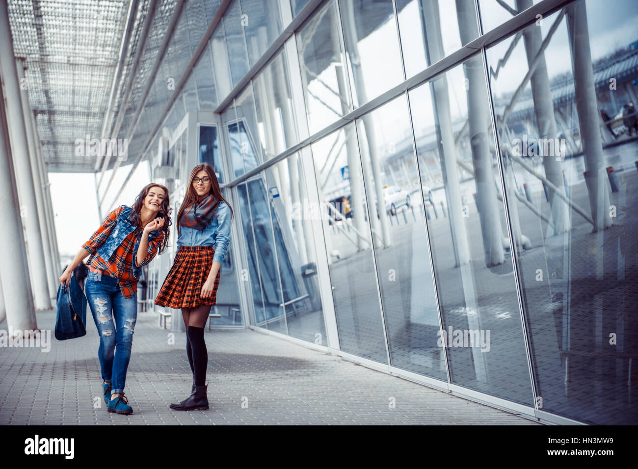 Girls having fun and joking while waiting for your flight with a Stock ...