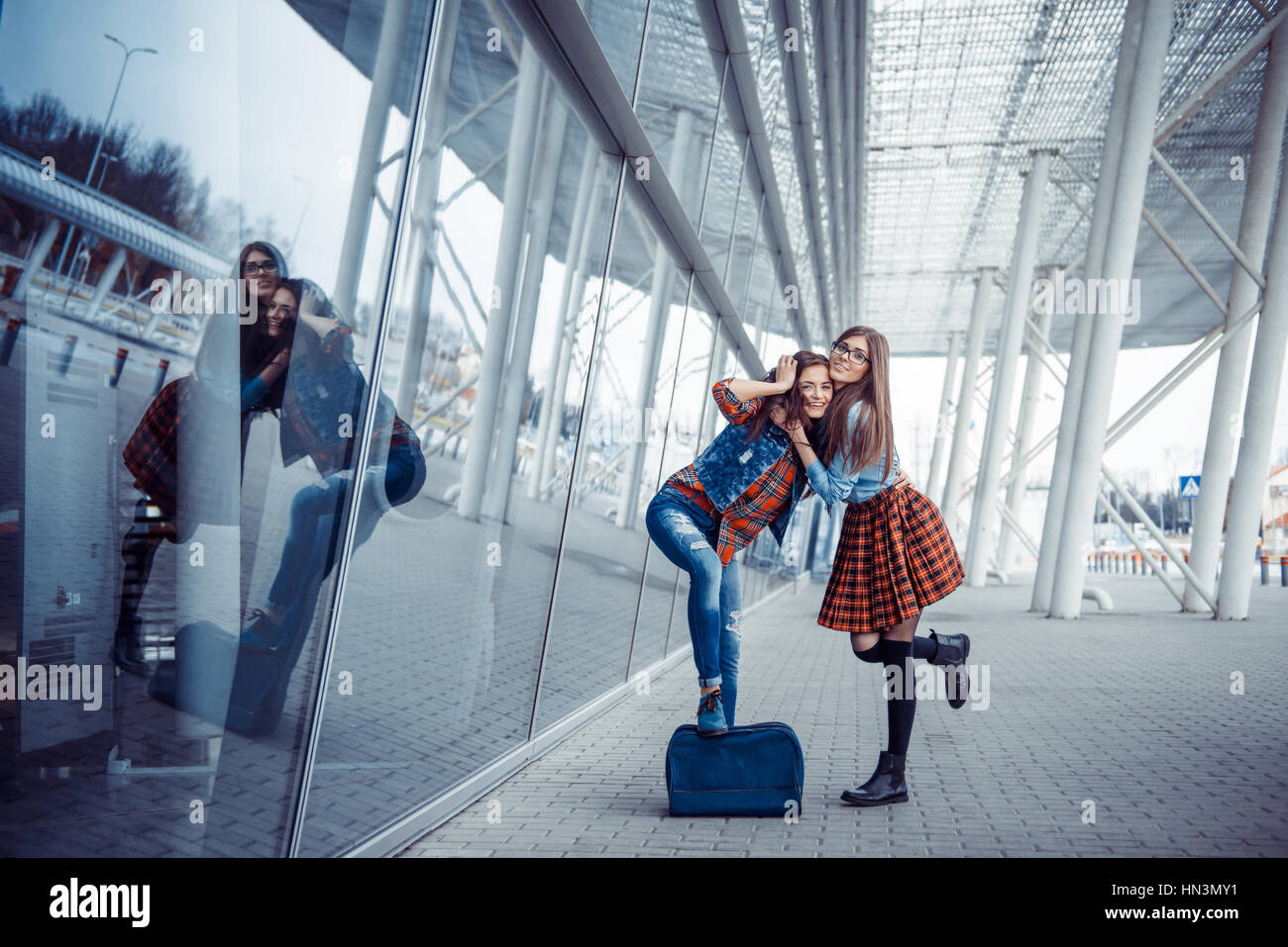 Girls having fun and happy when they met at the airport.Art proc Stock ...