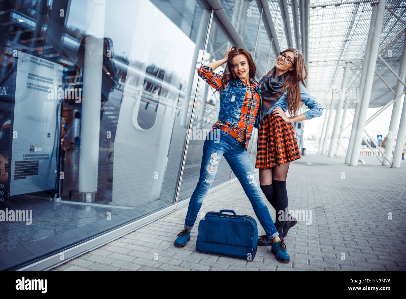 Girls having fun and joking while waiting for your flight with a Stock ...
