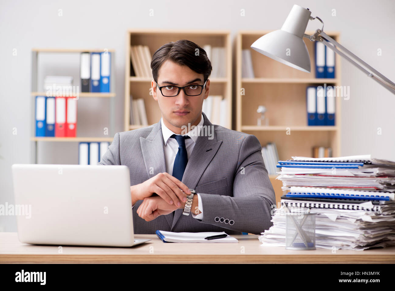 Handsome businessman working in the office Stock Photo - Alamy