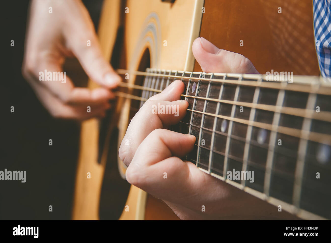 Close up of guitarist hand playing acoustic guitar Stock Photo - Alamy